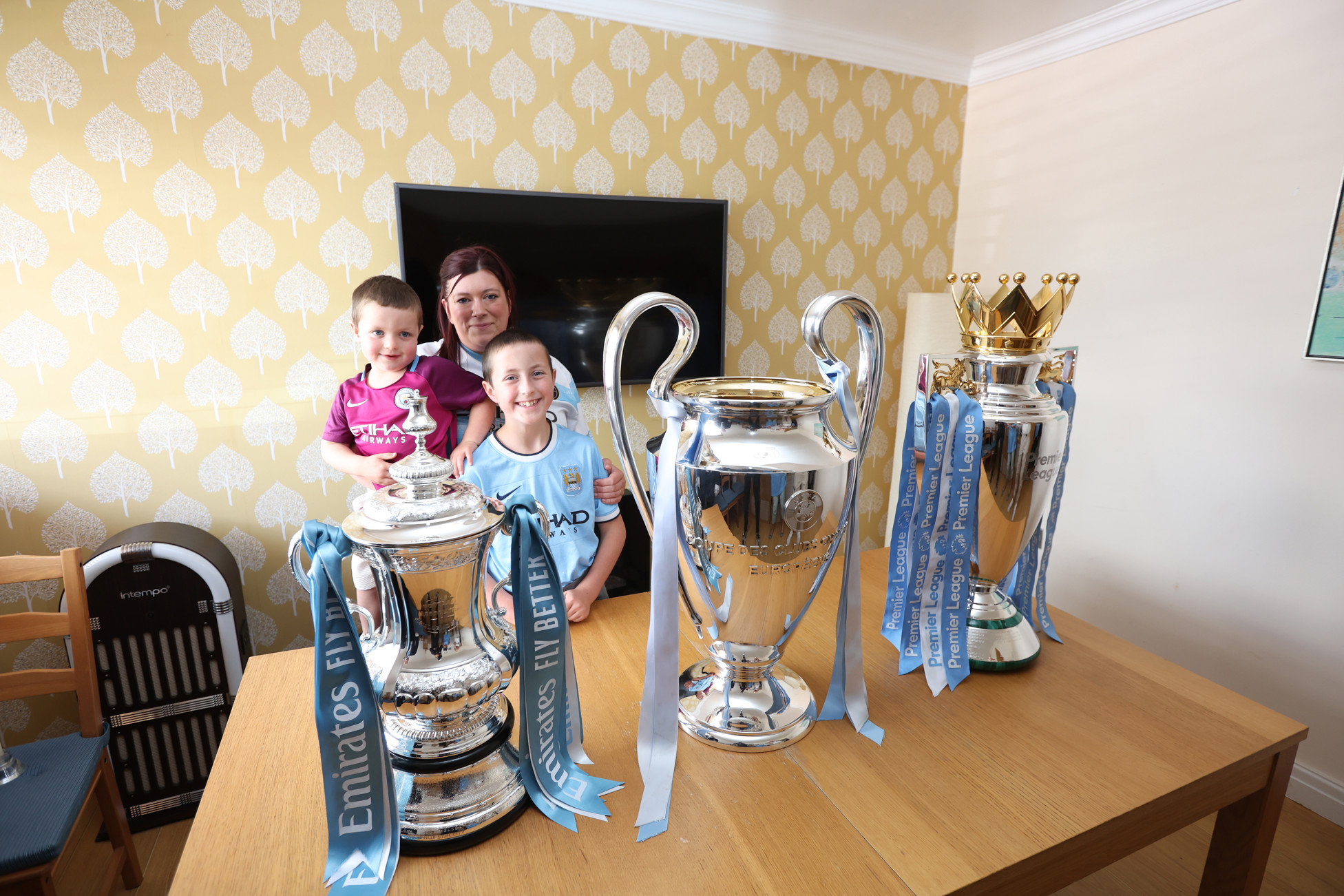 Official Supporters Club members surprised with Treble trophies